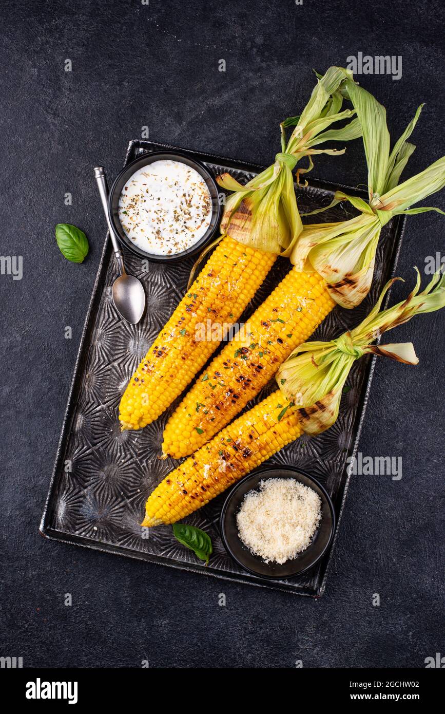 Grilled corn cobs with parmesan cheese Stock Photo - Alamy