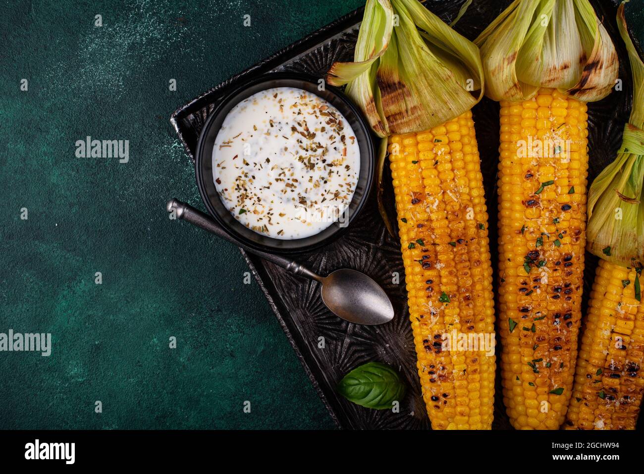 Grilled corn cobs with parmesan cheese Stock Photo - Alamy