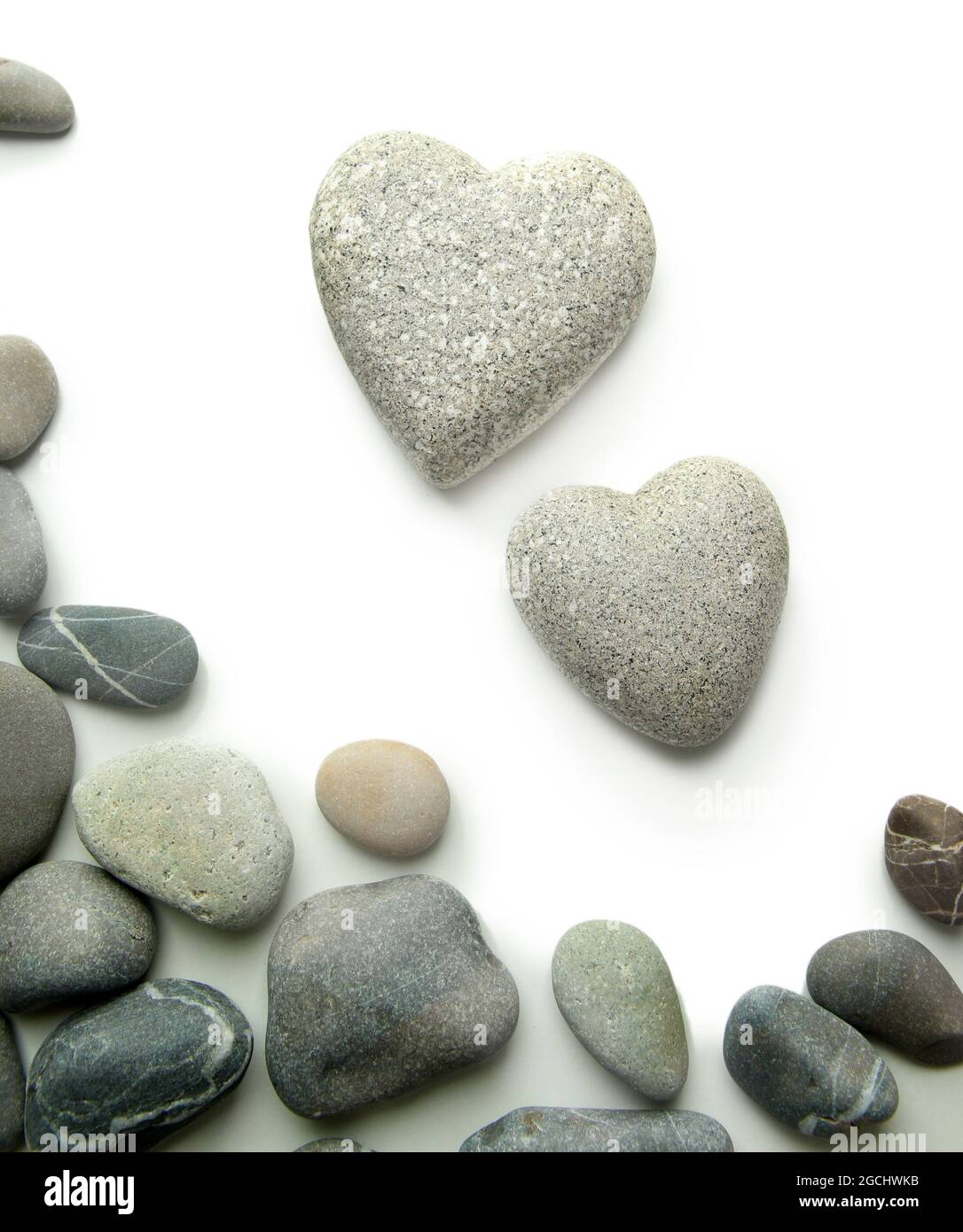 Grey stones in shape of heart, isolated on white Stock Photo - Alamy