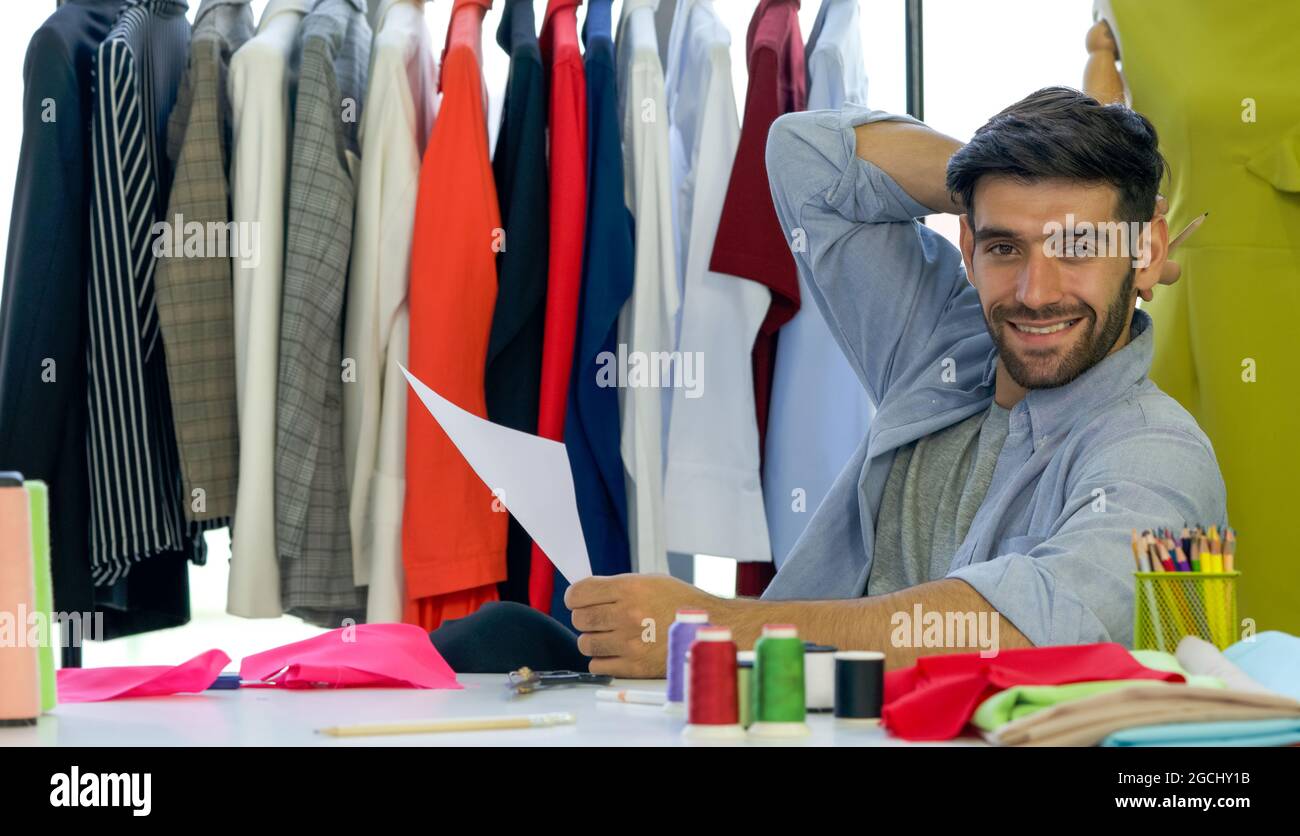 Fashion designer room, the tailor designs a new collection of clothes ...