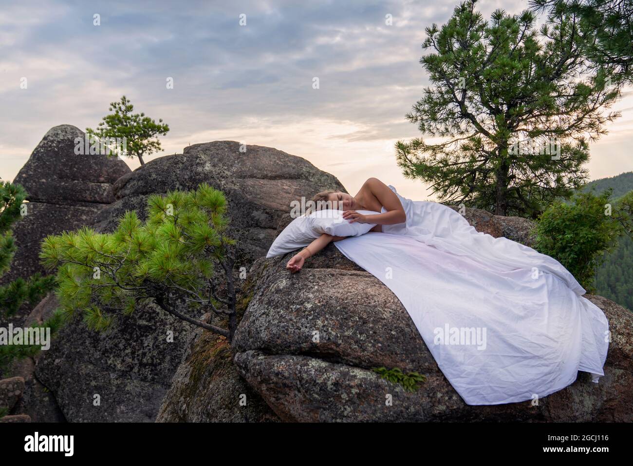 sleep and relax in a picturesque place in nature. A young woman is ...