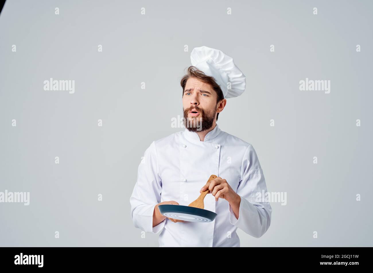 professional chef frying pan cooking food kitchen work Stock Photo - Alamy