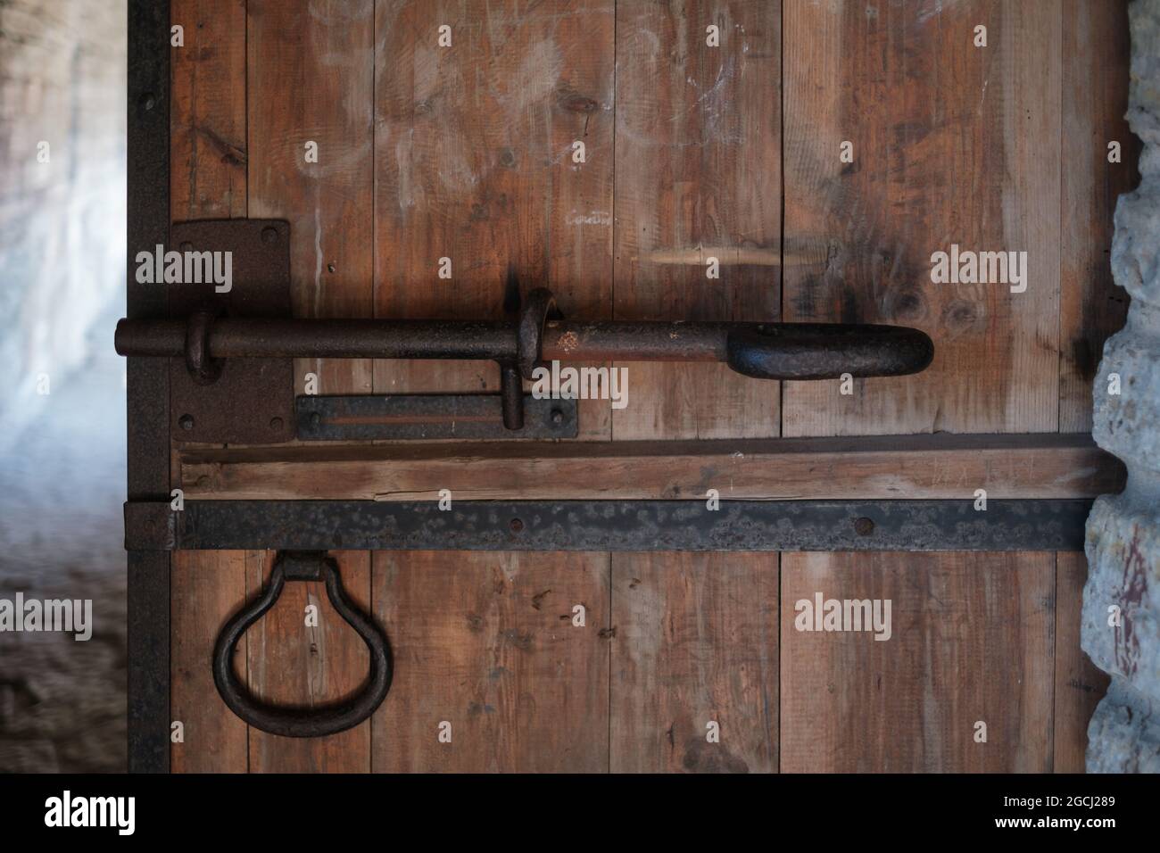An old door with a rusty iron lock Stock Photo - Alamy