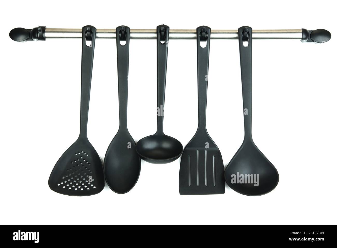 Plastic kitchen utensils on silver hooks isolated on white Stock Photo ...