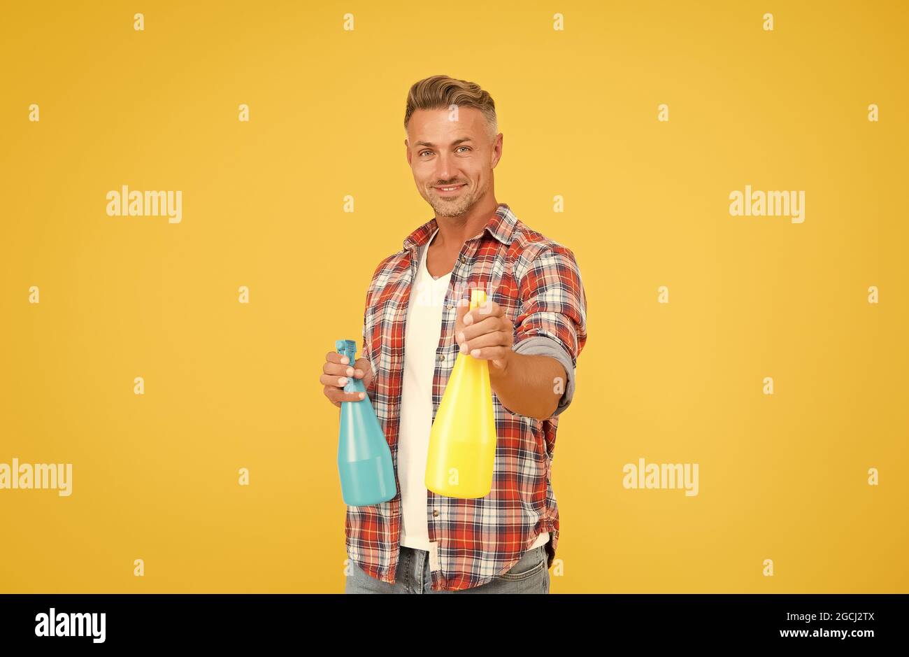 Man spray disinfectant liquid around himself, antibacterial concept ...