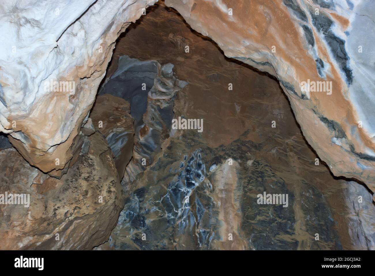 Speleology. Old cave washed by an underground river in the mountain ...