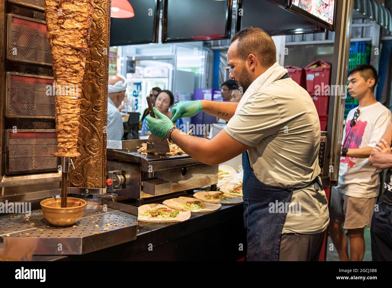 Cook slices chicken shawarma on hi-res stock photography and images - Alamy