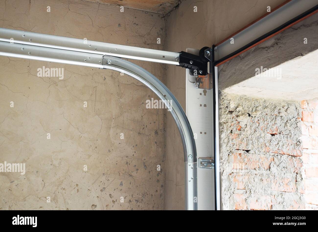 Garage door installation. A garage door opening system with a close-up ...
