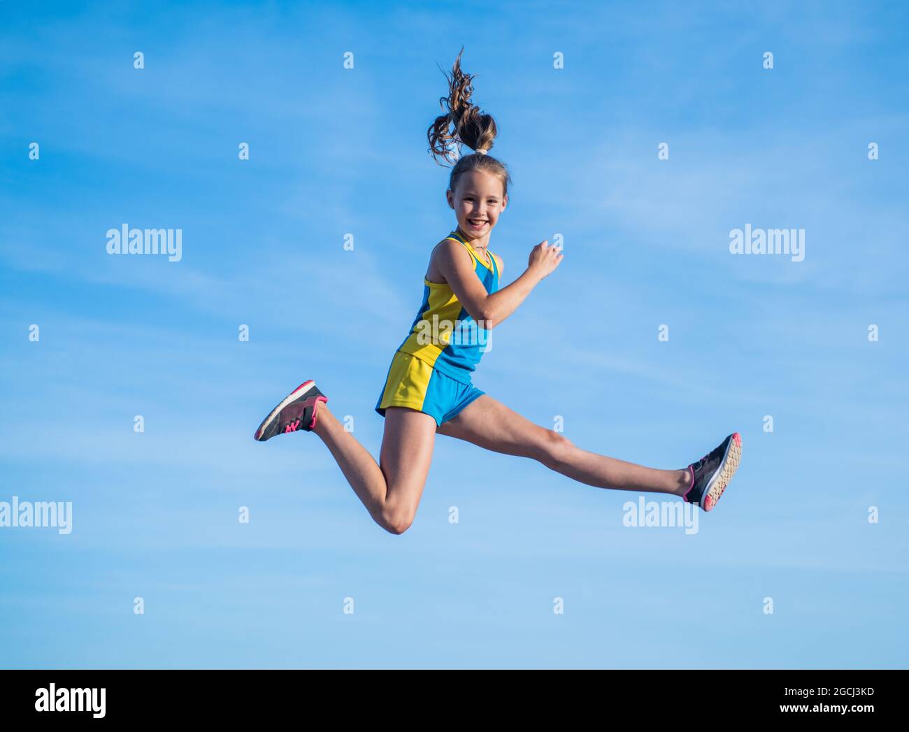 sense of freedom. energetic teen girl jumping on sky background Stock ...