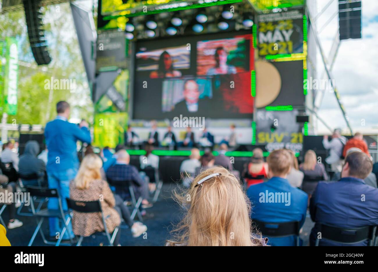 Participants of open air conference listening to speaker Stock Photo ...