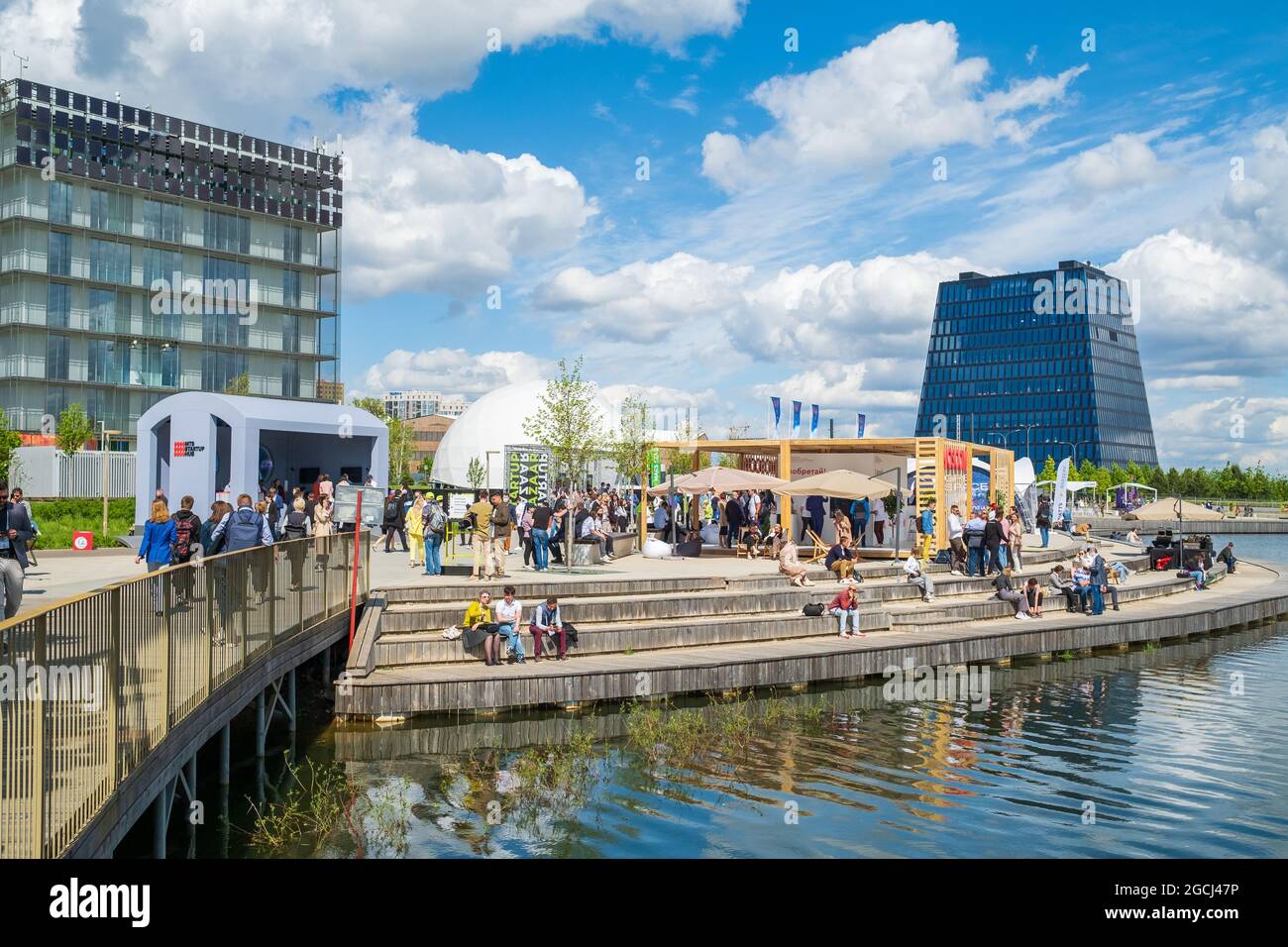 People gathering in park during business event Stock Photo - Alamy