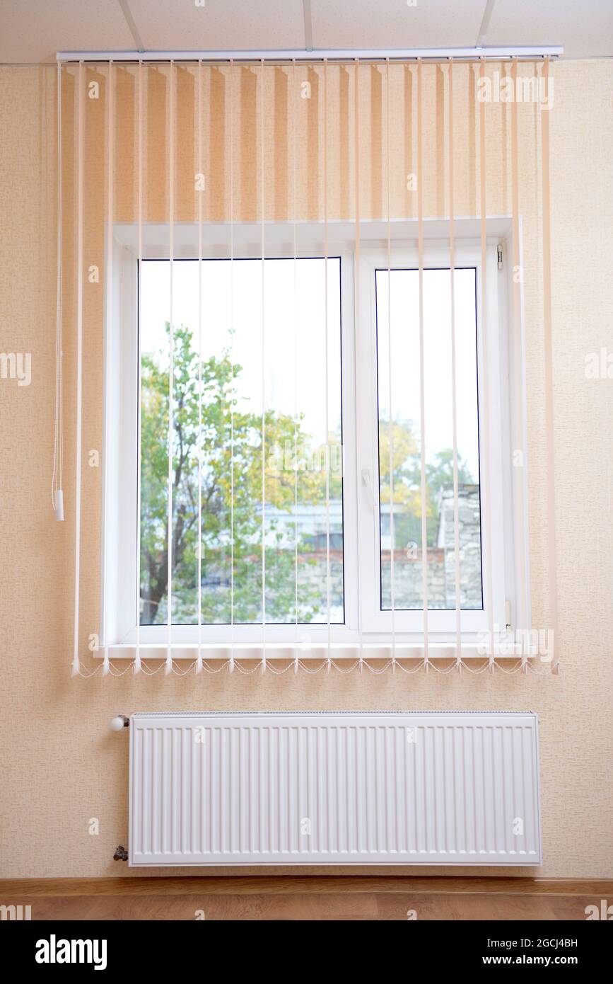 Photo heating radiator under window Stock Photo - Alamy