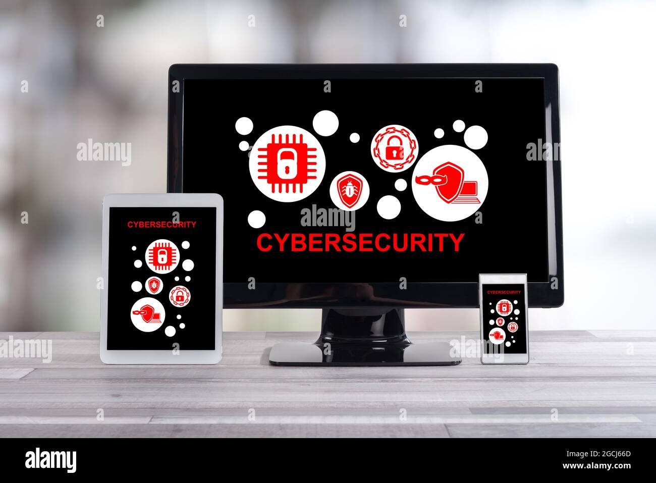 Cybersecurity concept shown on different information technology devices ...
