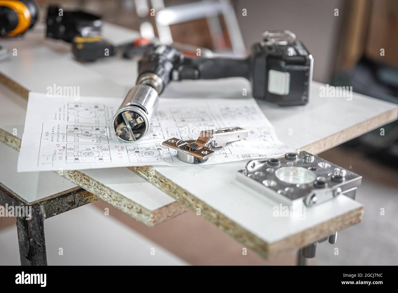 Close-up of precision drilling fixture and other carpenter's tools ...