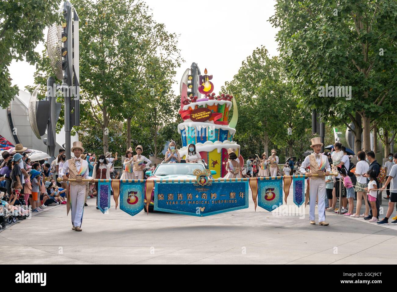 SHANGHAI, CHINA - AUGUST 8, 2021 - Tourists watch a float parade at ...