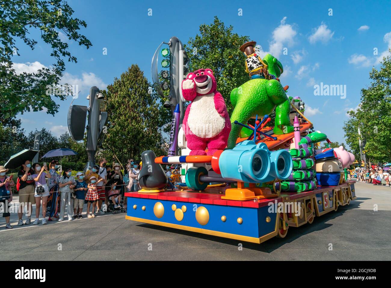 SHANGHAI, CHINA - AUGUST 8, 2021 - Tourists watch a float parade at ...