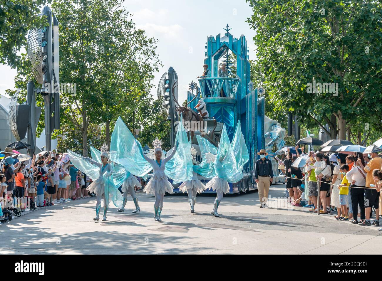 SHANGHAI, CHINA - AUGUST 8, 2021 - Tourists watch a float parade at ...