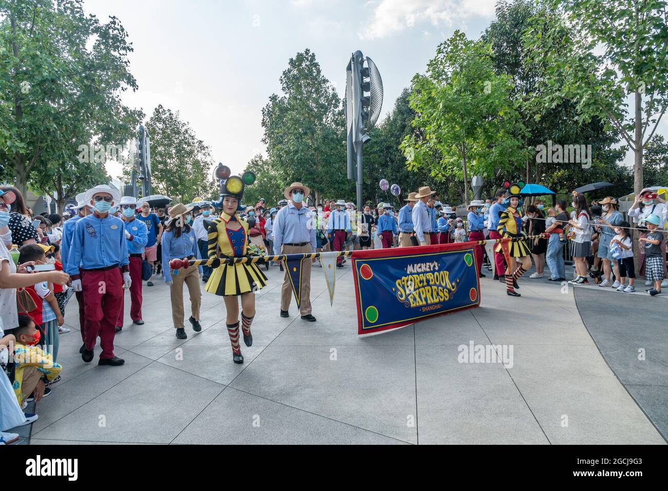 SHANGHAI, CHINA - AUGUST 8, 2021 - Tourists watch a float parade at ...