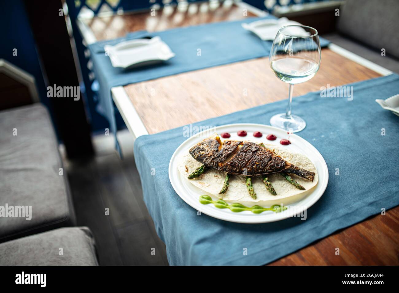 Dish of gourmet grilled dorada fish Stock Photo - Alamy