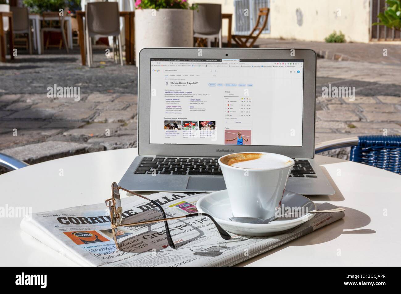 Breakfast with cappuccino and computer Stock Photo - Alamy