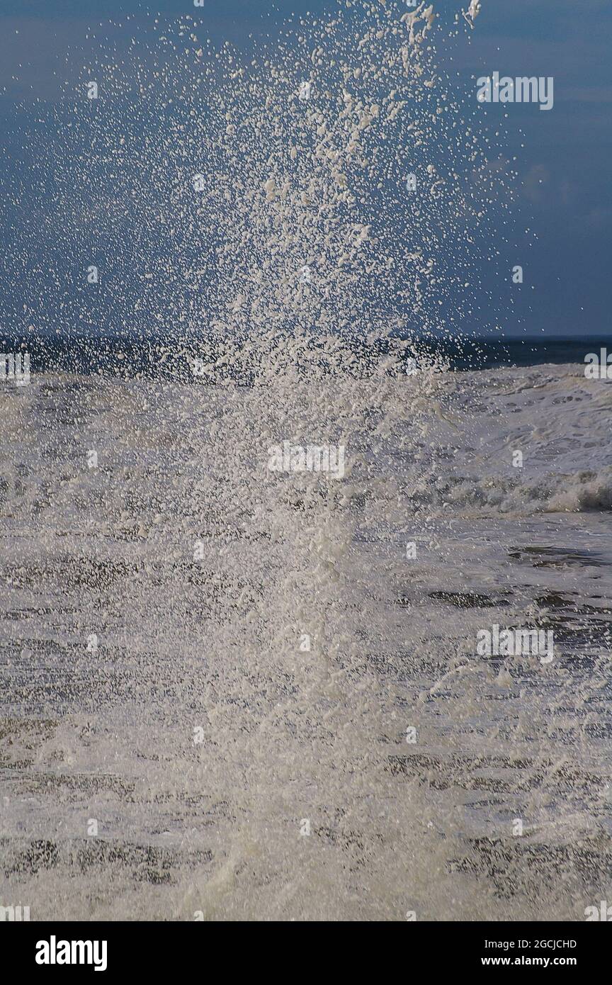 Vertical plume of sea-spray beside a beach on the Gold Coast ...