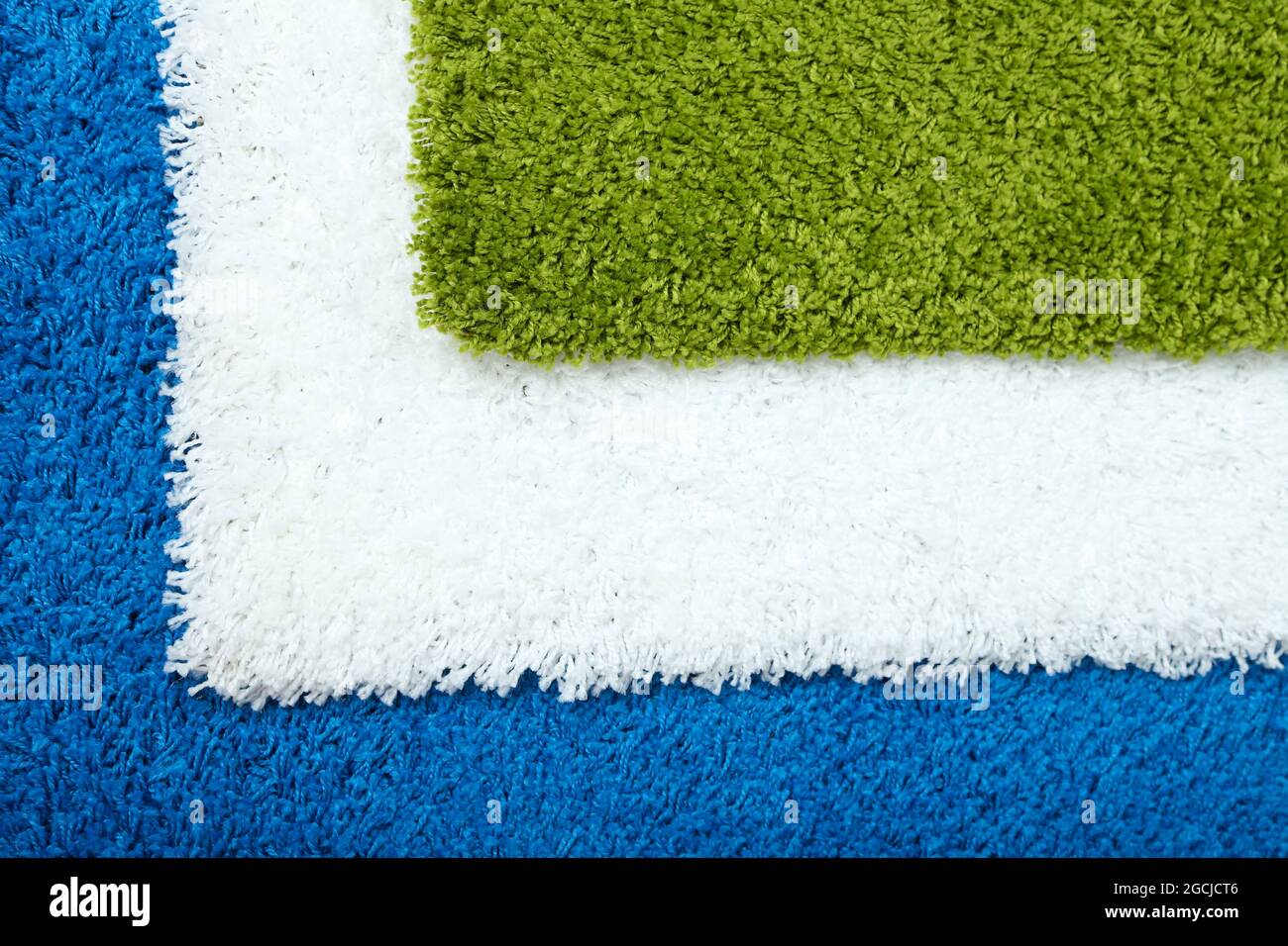 Many carpets of different colors close-up Stock Photo - Alamy