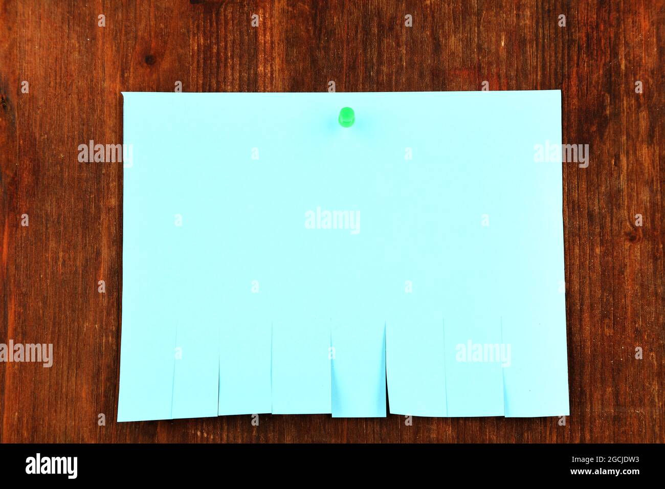Paper ads on wooden background Stock Photo - Alamy