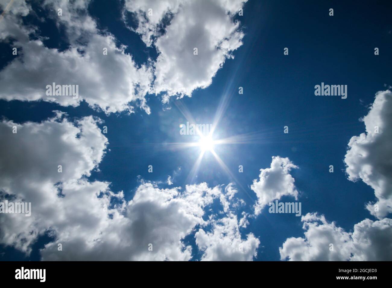 natural clouds blue sky sun ray light Stock Photo - Alamy