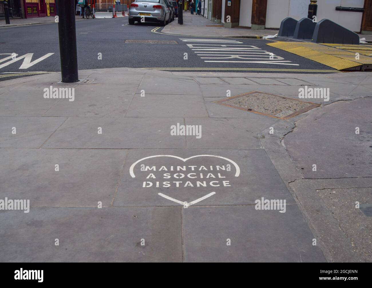 Social distancing heart-shaped sign on the pavement in Soho during the ...