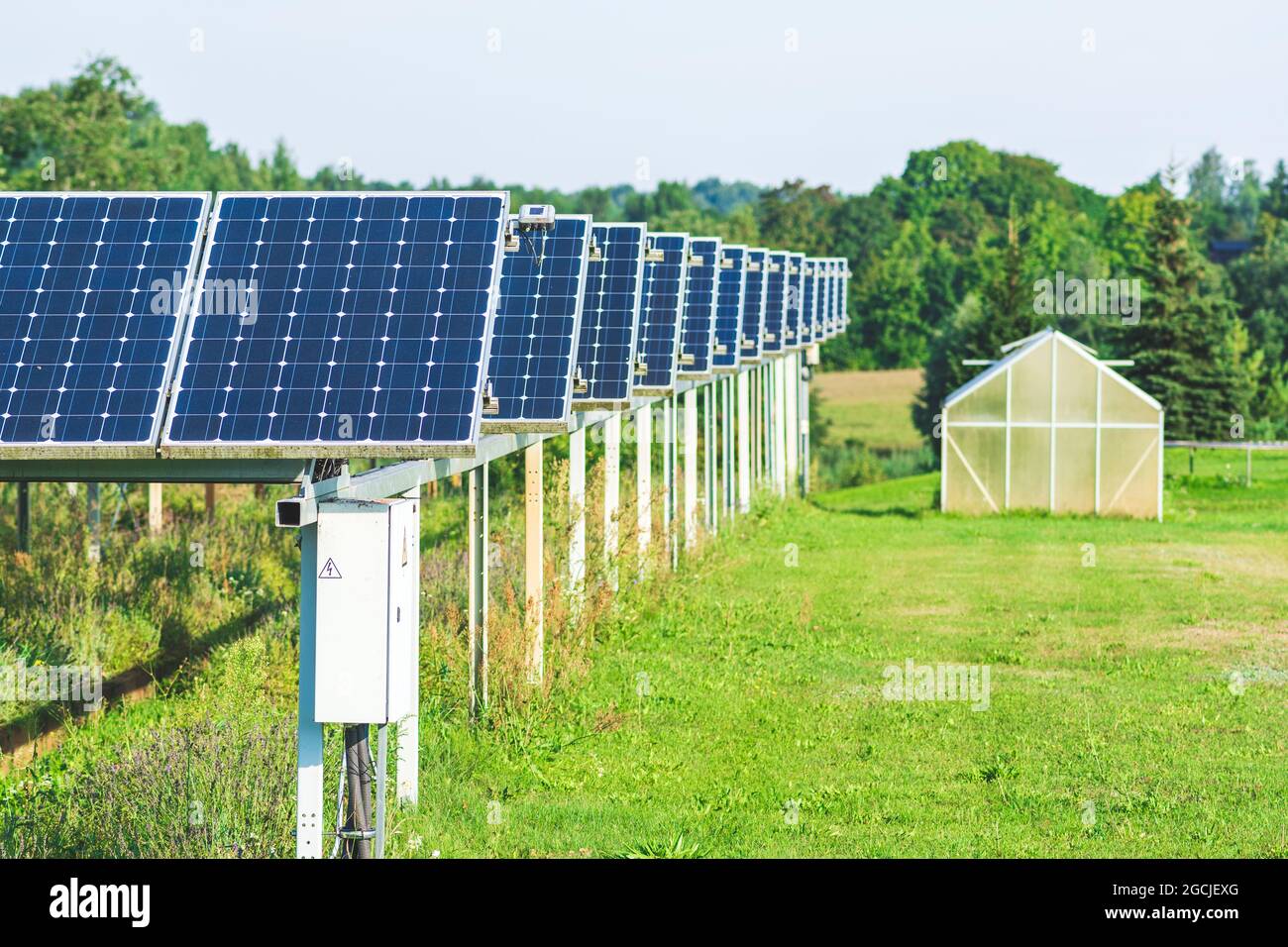 Solar panels in an agriculture green field in the countryside. Solar ...