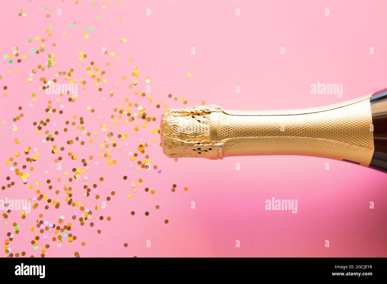 a bottle of champagne and a scattering of confetti. Christmas ...
