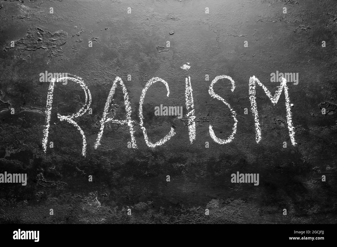 racism inscription on a black background concept Stop racism Stock ...