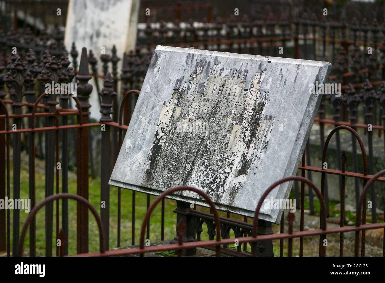 Decaying grungy headstone plaque in old rundown cemetery Stock Photo ...