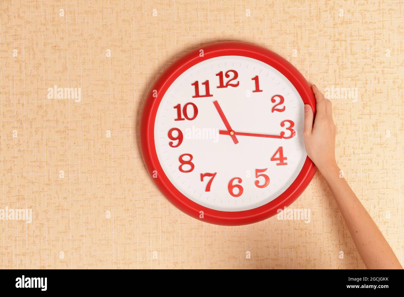 Clock on wall background Stock Photo - Alamy