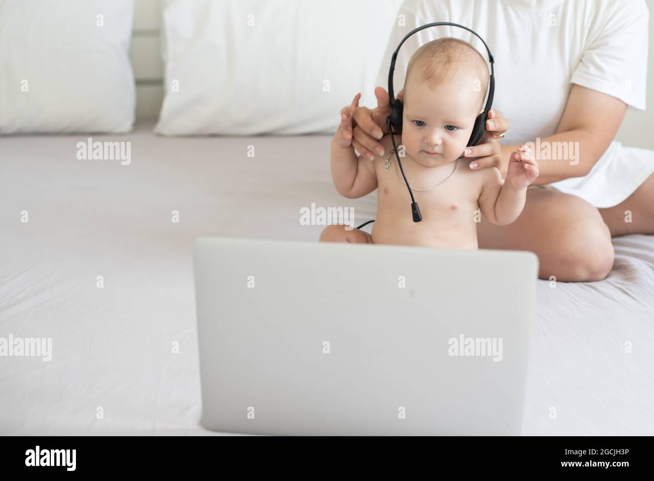 Mom and baby with laptop computer working from home Stock Photo - Alamy