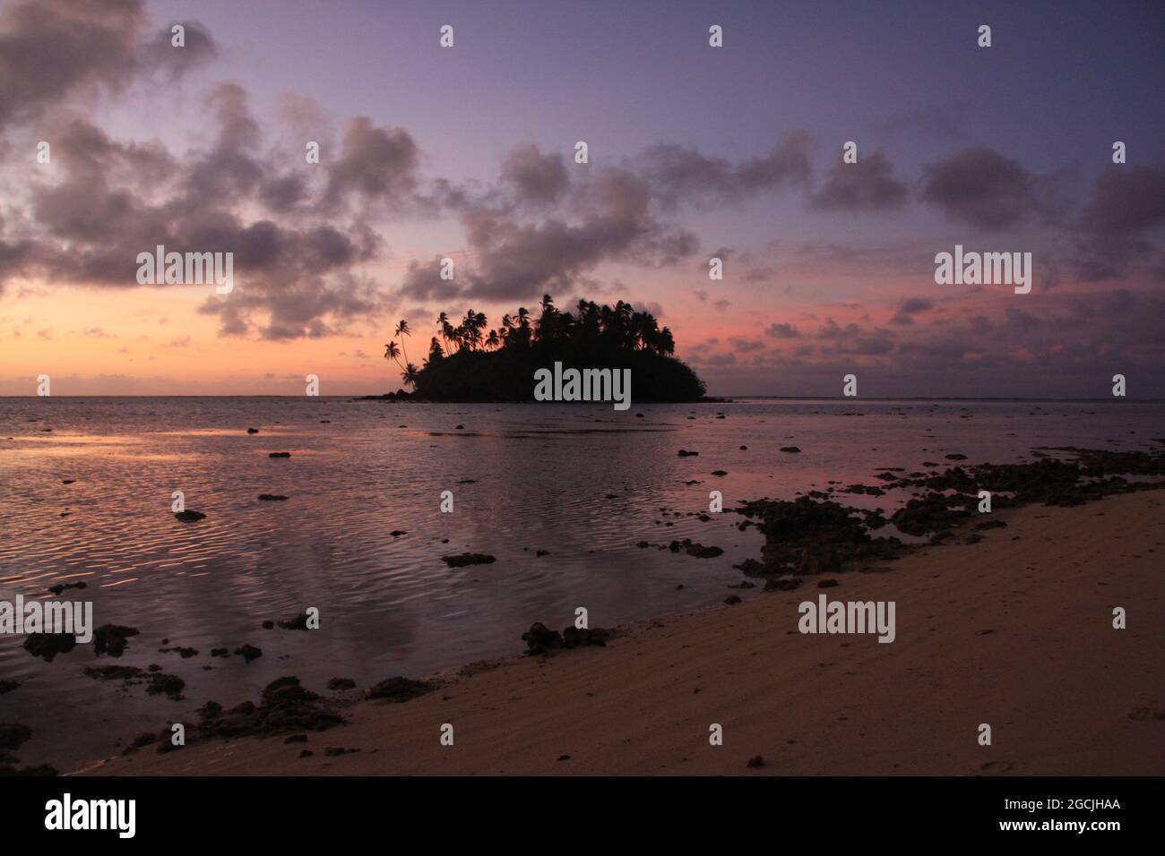 an island at sunset in cook islands Stock Photo - Alamy