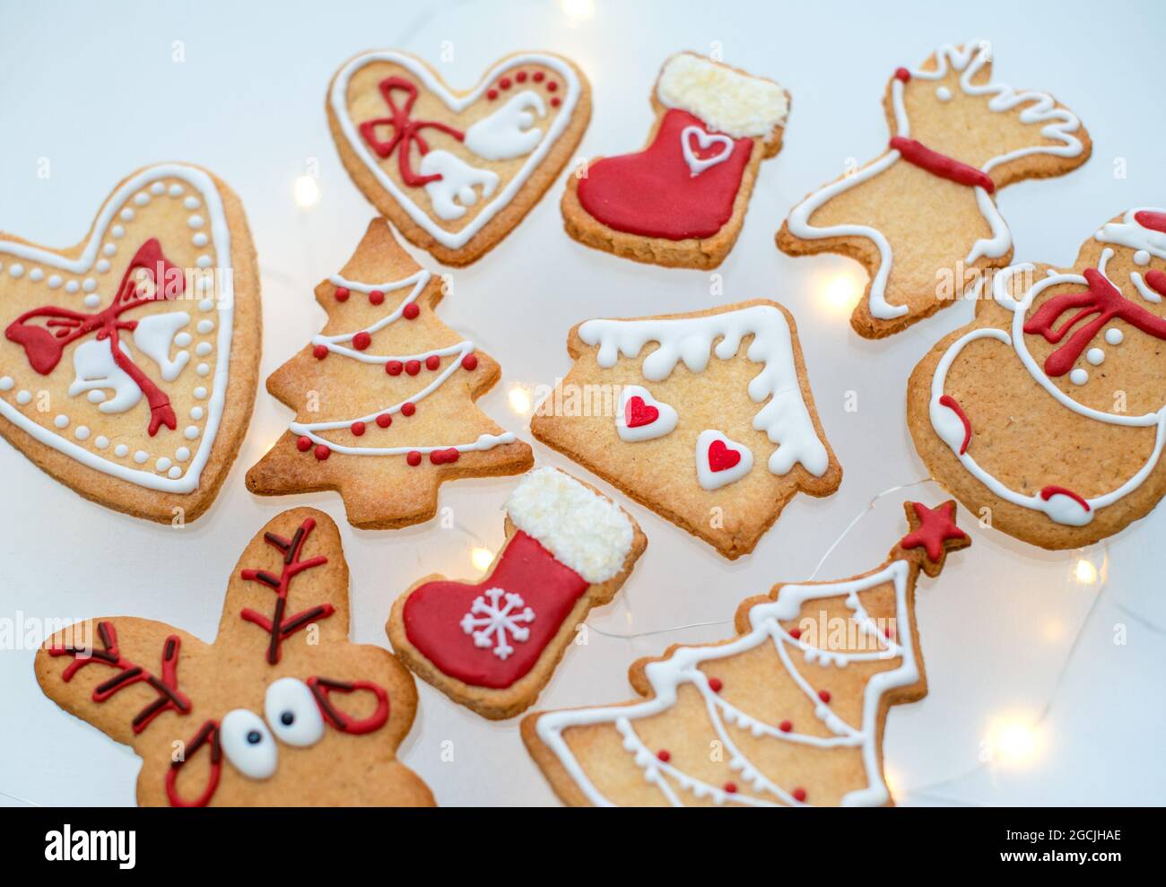 Top view of homemade Christmas gingerbread cookies decorated with red ...