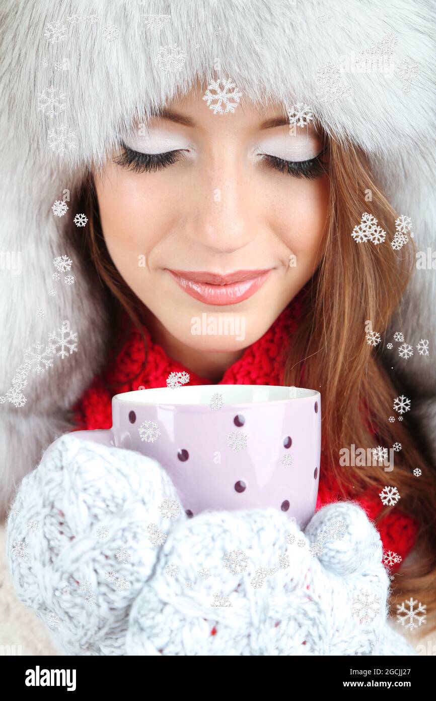Beautiful girl in hat with cup close-up Stock Photo - Alamy