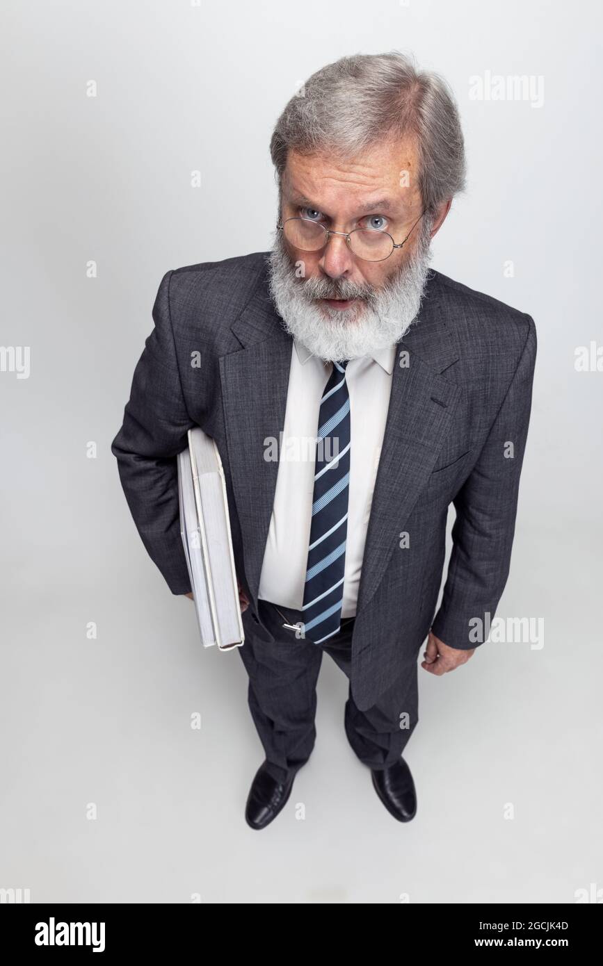 Funny professor, teacher, scientist posing isolated on gray studio ...