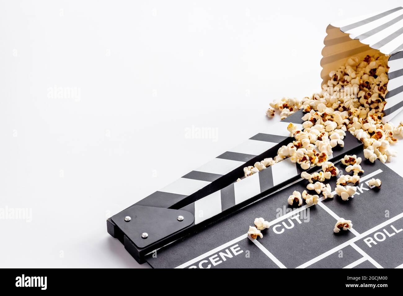 Close up of popcorn with movie clapper board. Cinema background Stock ...