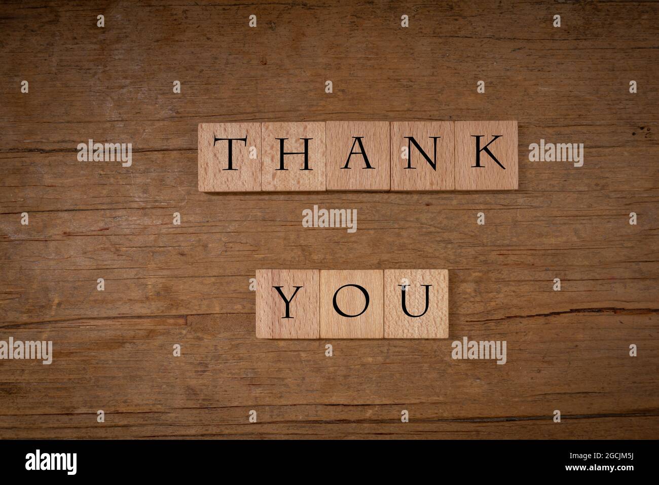 thank you message on wooden blocks on rustic table Stock Photo - Alamy