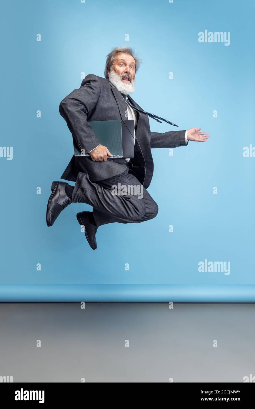 Scared professor, teacher, gray-headed bearded man running, hurrying to ...