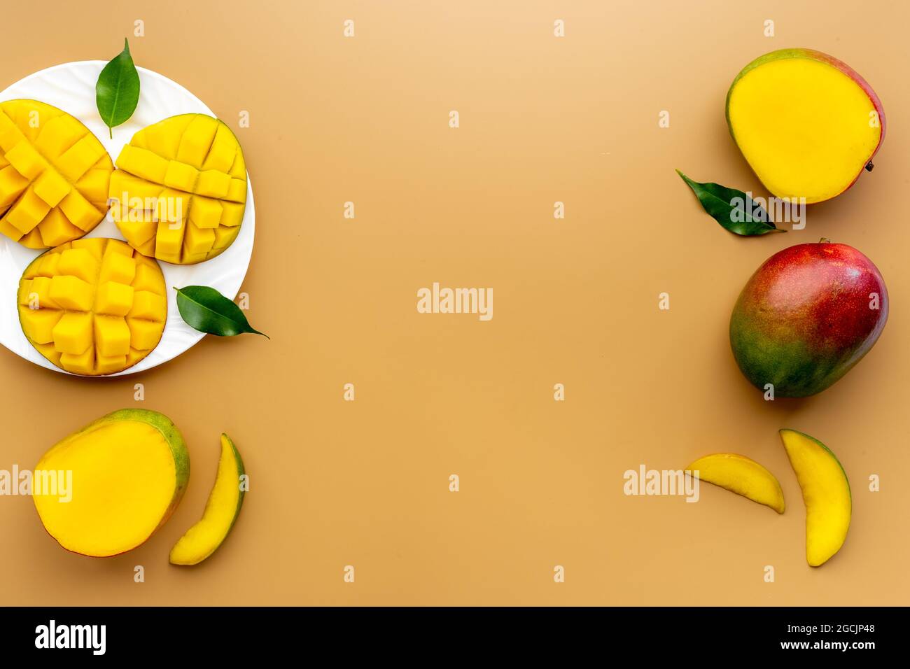 Plate of mango fruits and mango cubes. Tropical breakfast. Top view ...