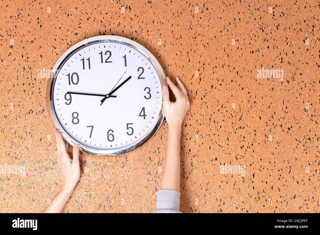 Clock on wall background Stock Photo - Alamy