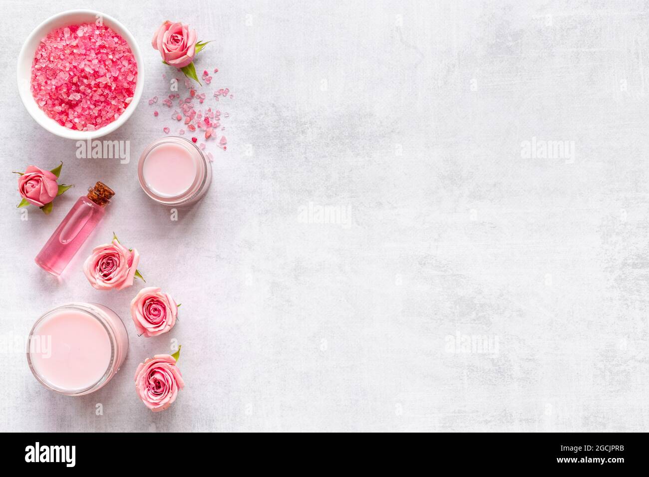 Set of roses cosmetic products with essential oil and liquid for skin ...