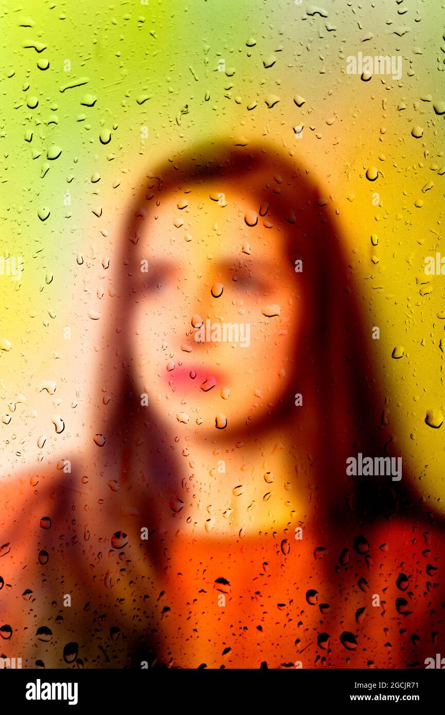 Woman behind glass hi-res stock photography and images - Alamy