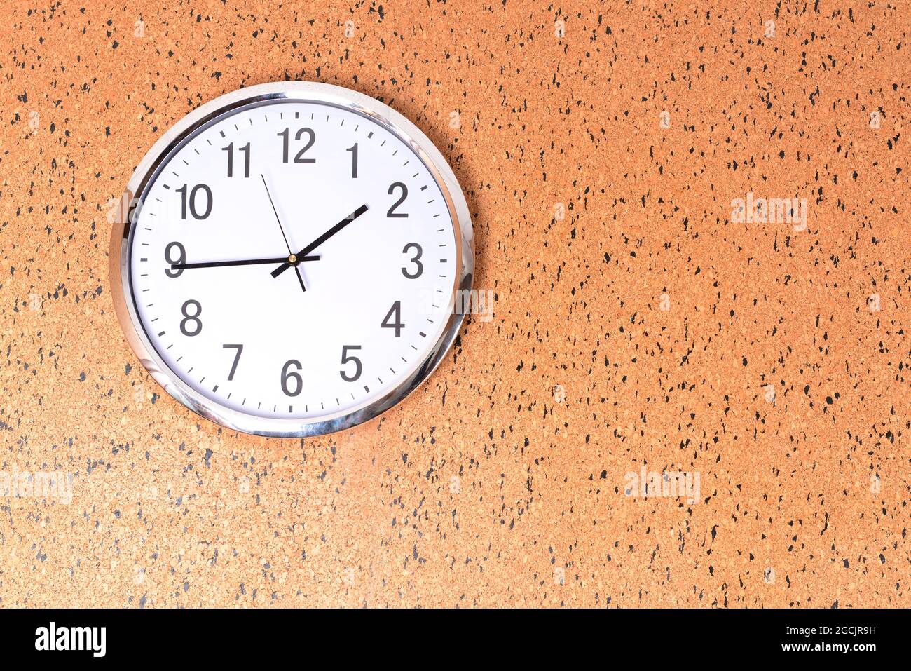 Clock on wall background Stock Photo - Alamy