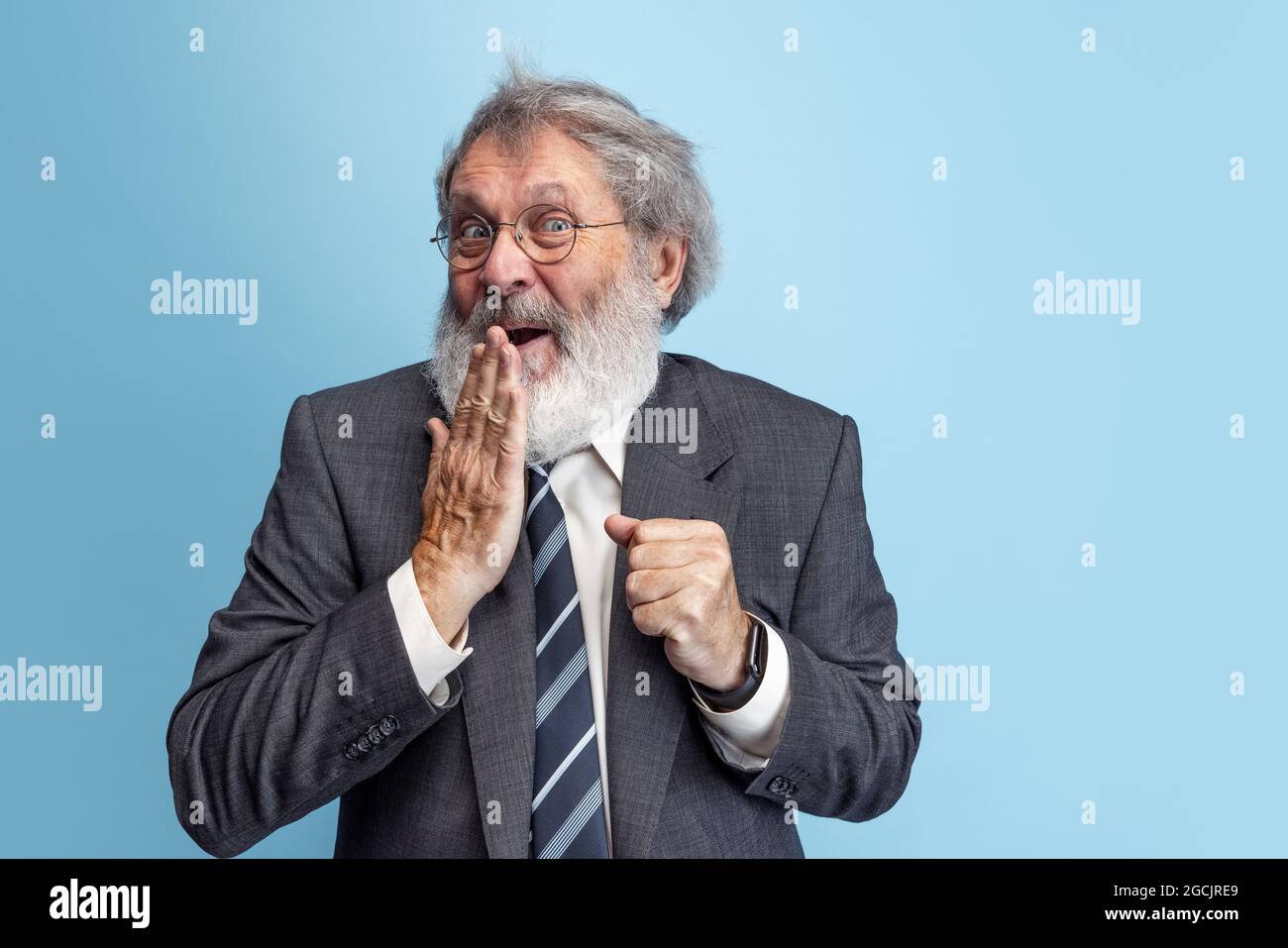Crazy professor, teacher, gray-headed bearded man posing isolated on ...