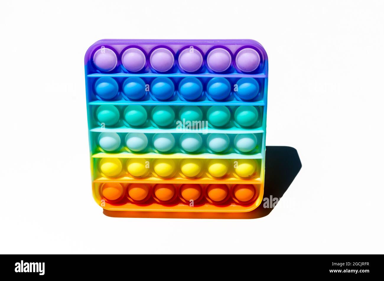 Colorful pop it fidget toy isolated on white background Stock Photo - Alamy
