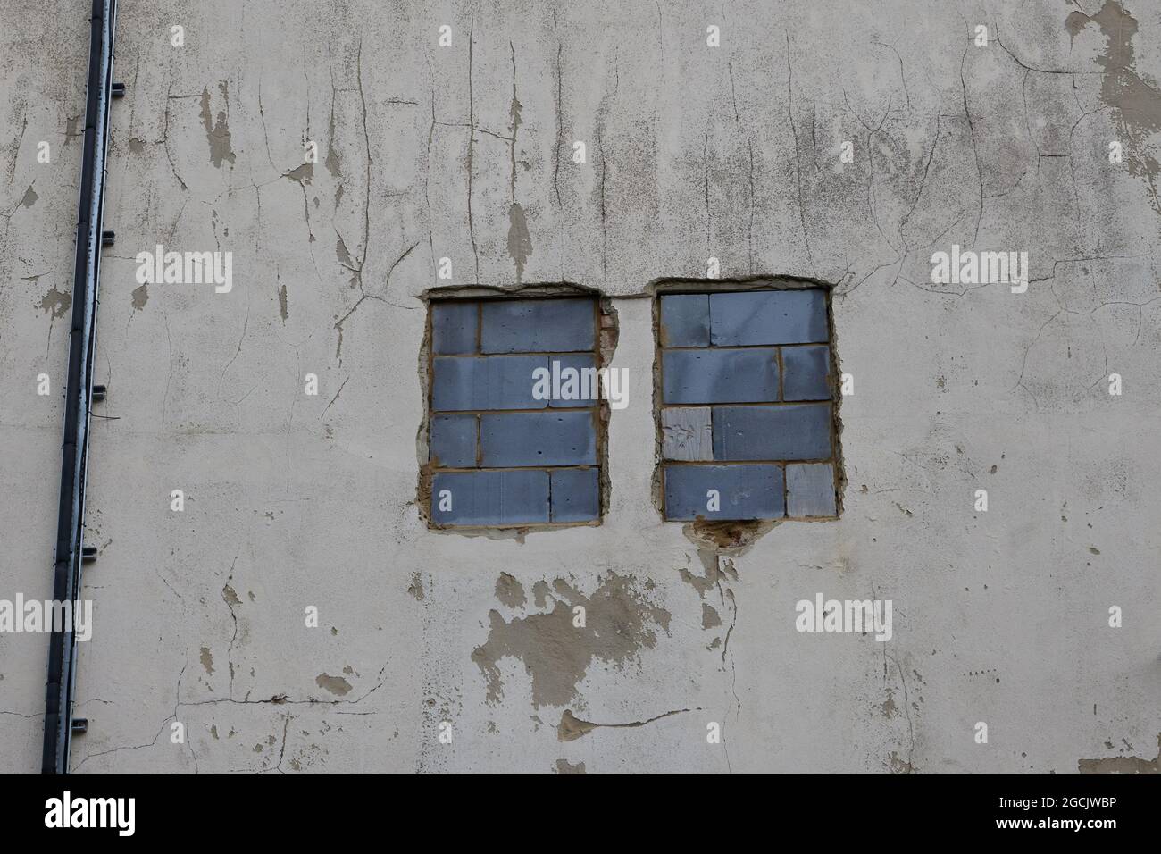 Two bricked up windows Stock Photo - Alamy
